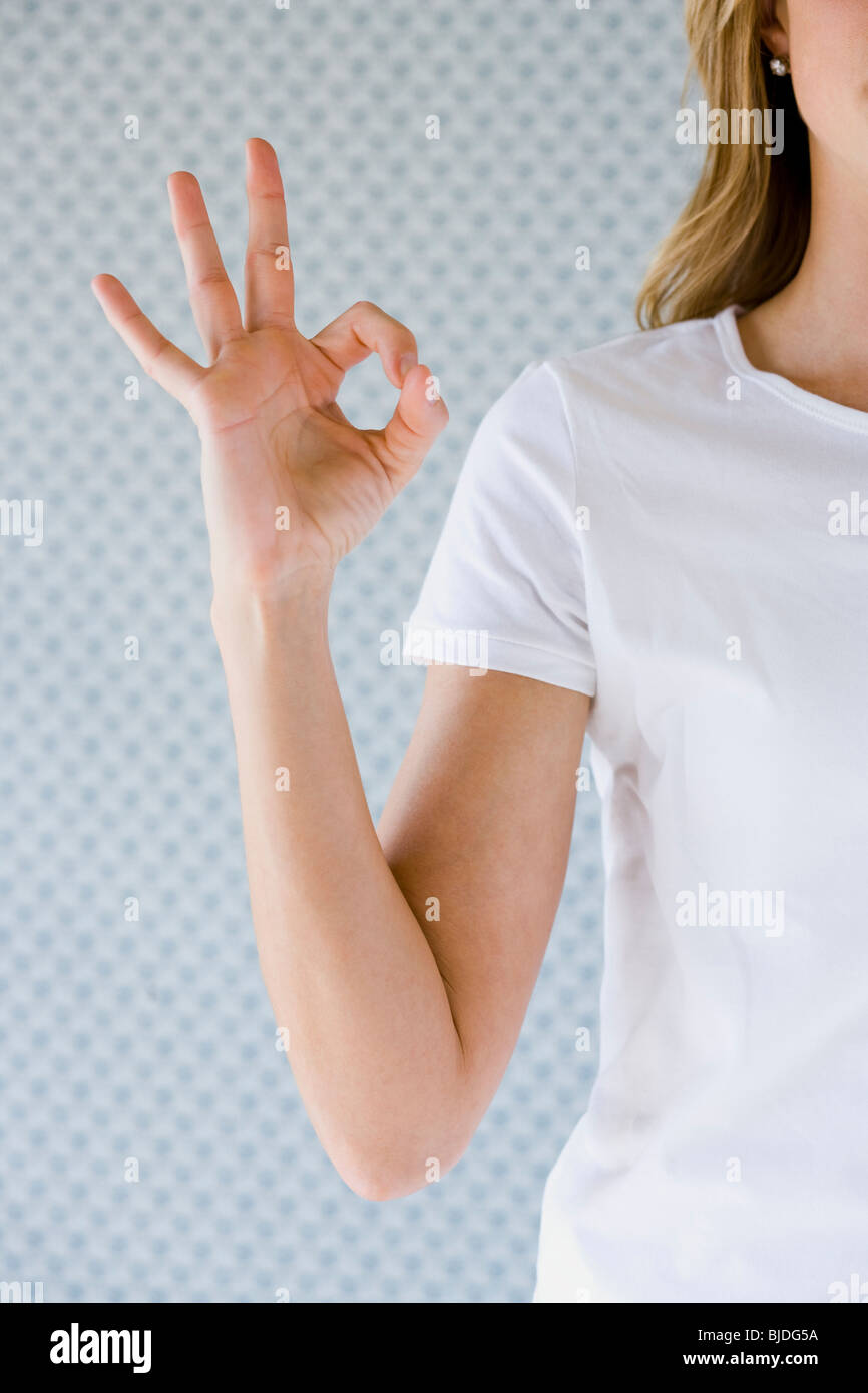 Woman making ok sign with her hand Stock Photo - Alamy