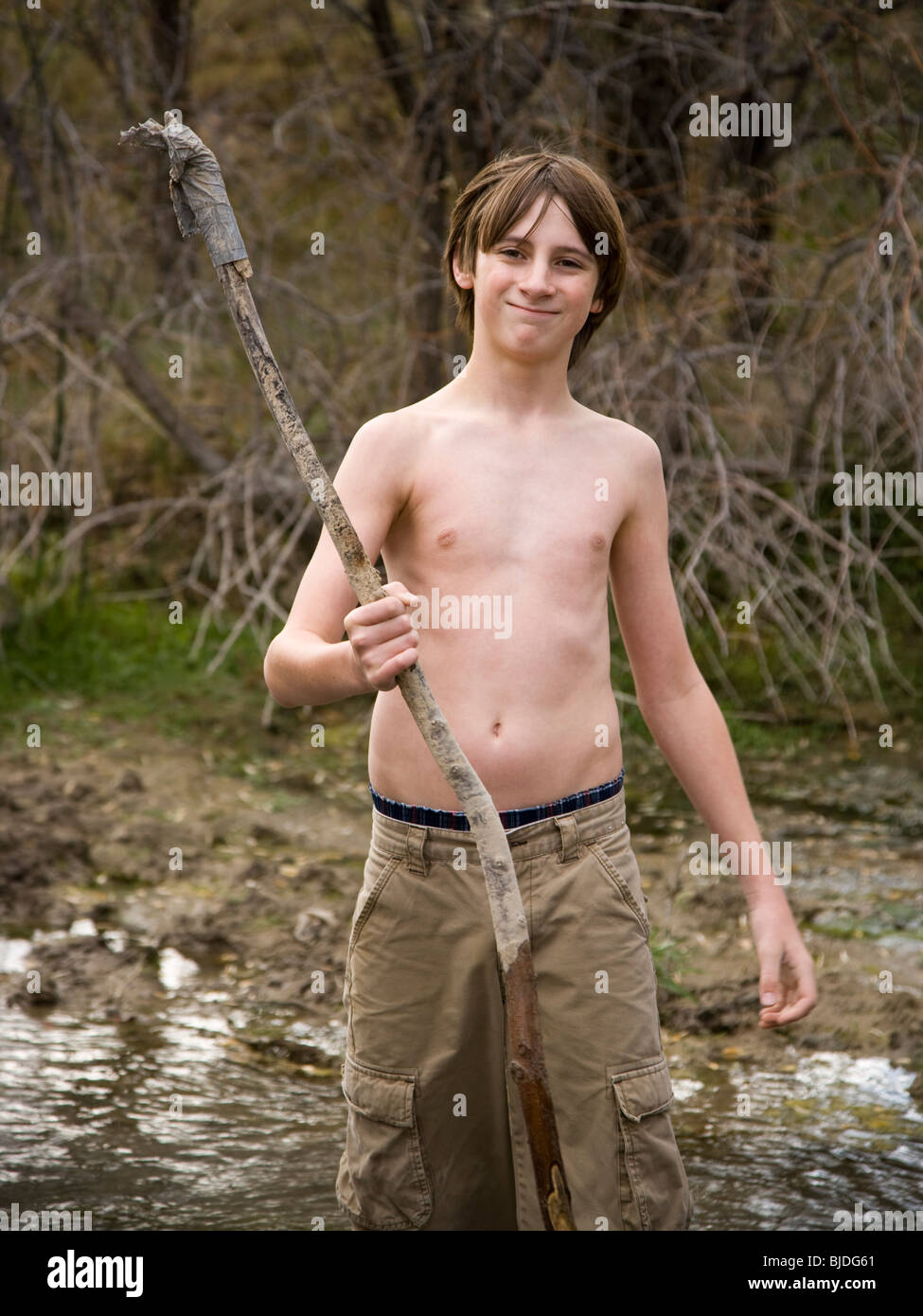 boy playing with a stick Stock Photo - Alamy