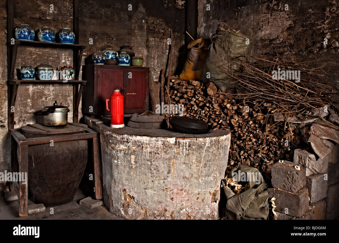 A traditional style kitchen in a residence at rural Chinese village ...