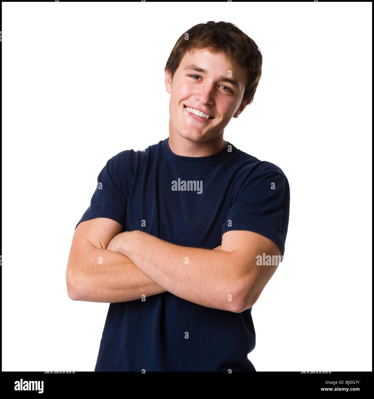young man with arms folded Stock Photo - Alamy