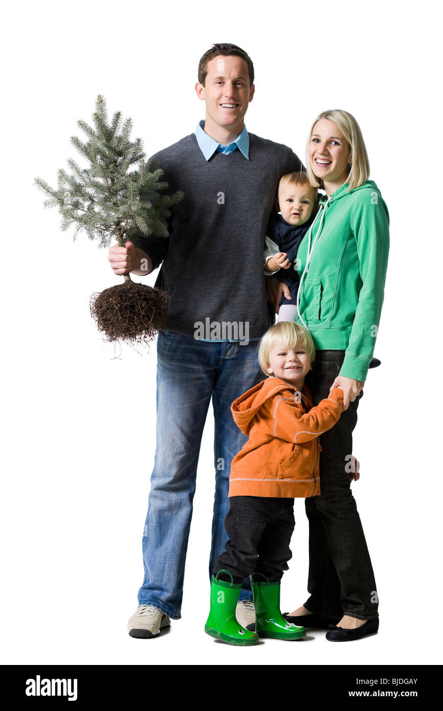 family with a pine tree Stock Photo - Alamy