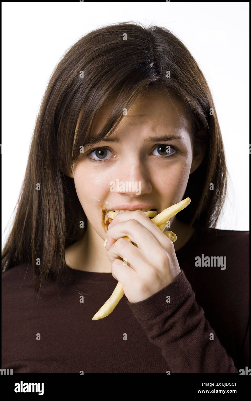 young woman eating junk food Stock Photo - Alamy