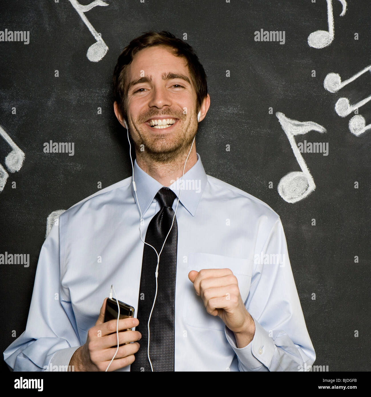 man listening to an mp3 player Stock Photo - Alamy