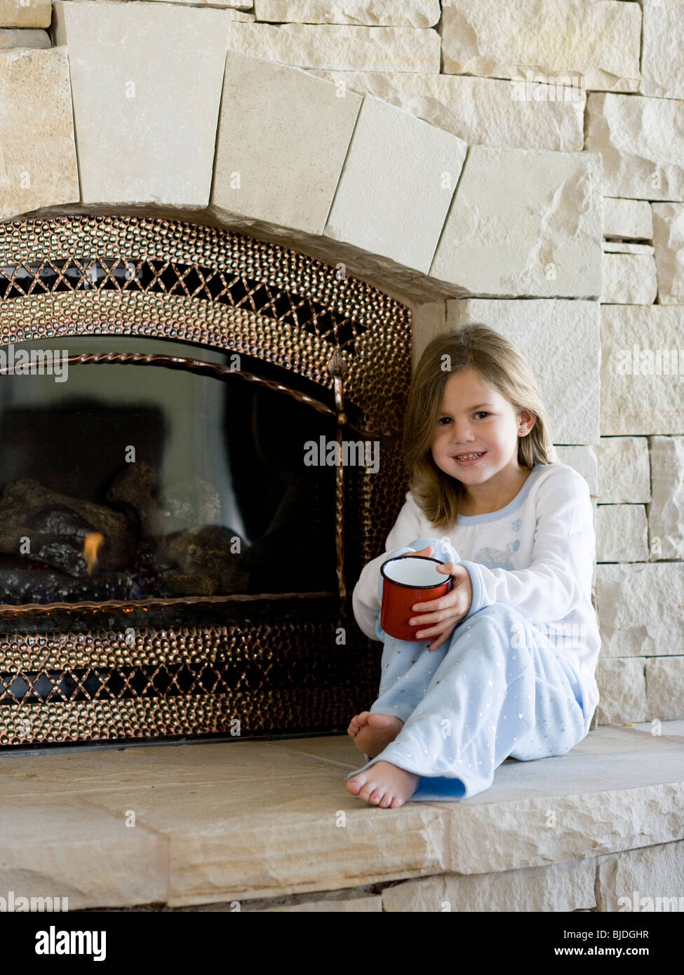 Child in front fireplace hi-res stock photography and images - Alamy