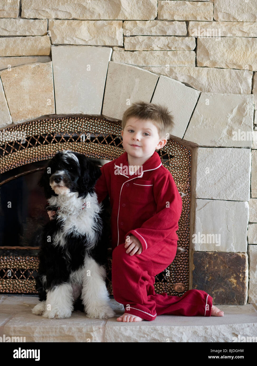 child in front of a fireplace Stock Photo - Alamy