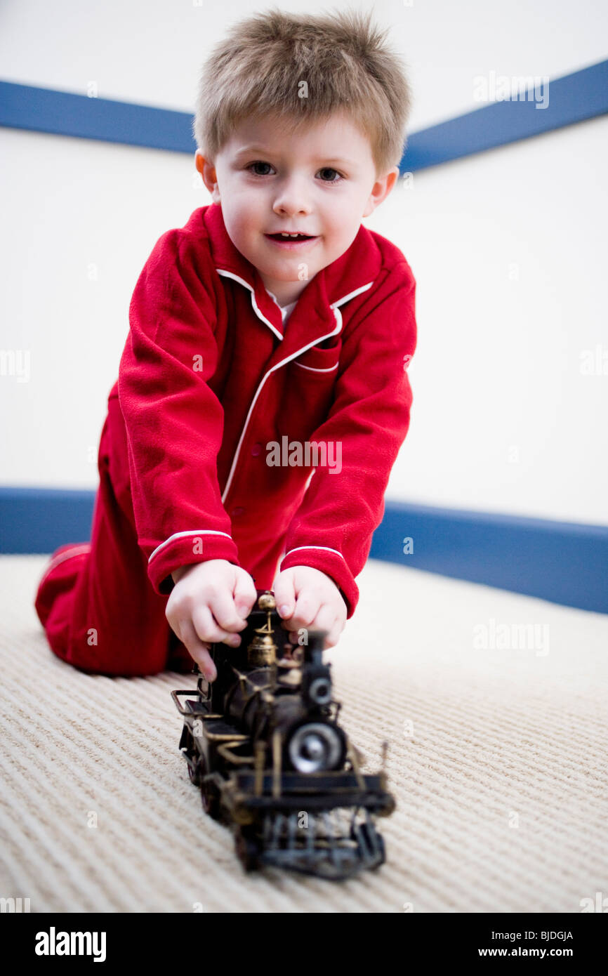 boy playing with a train Stock Photo - Alamy