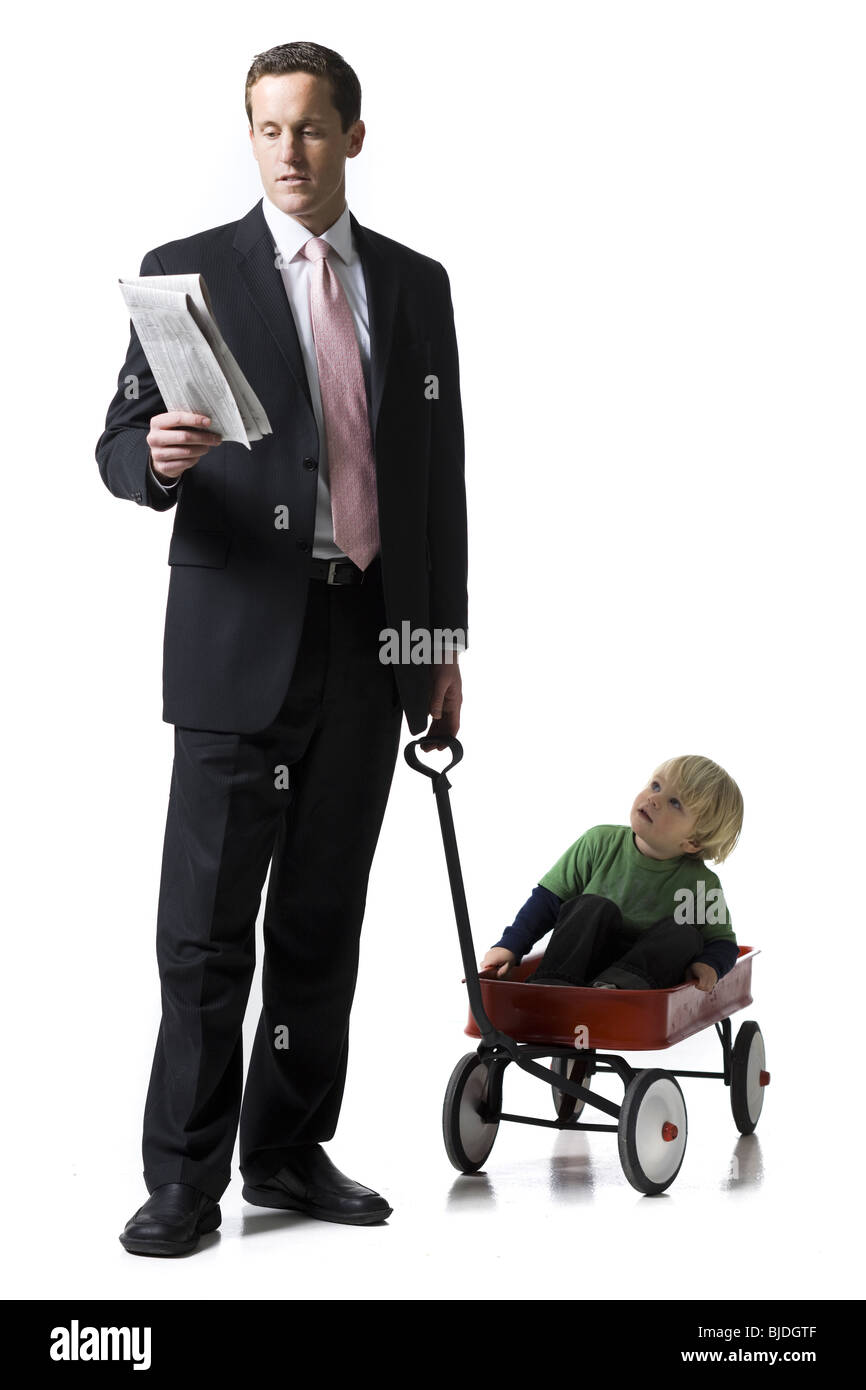 father reading a newspaper Stock Photo - Alamy