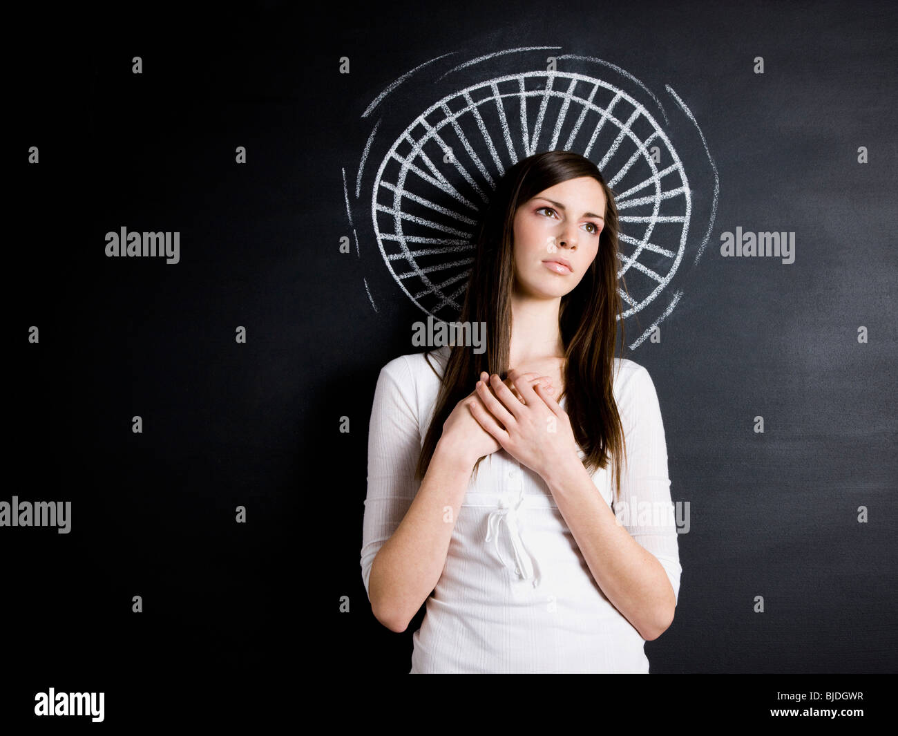 young woman against a chalkboard Stock Photo - Alamy