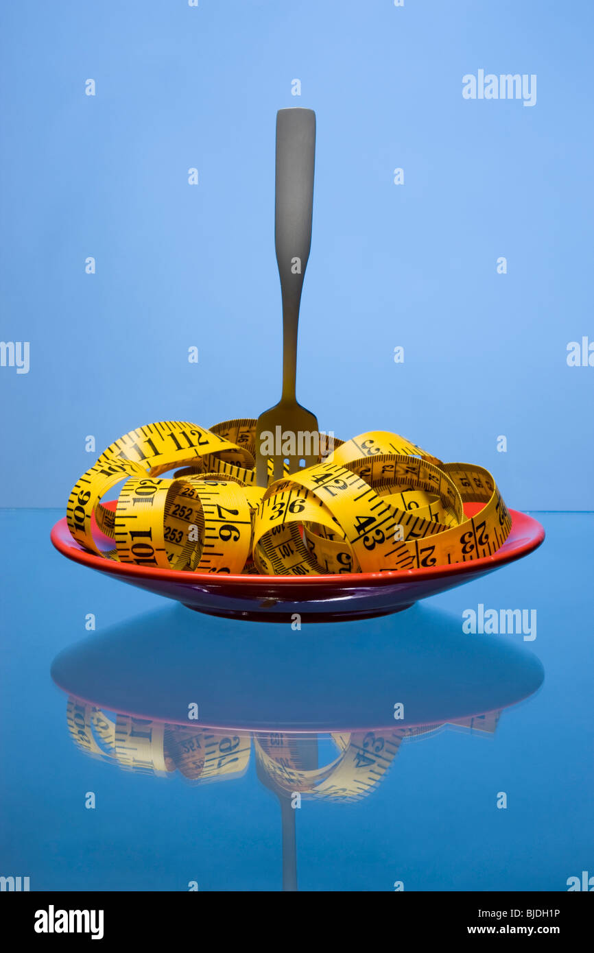measuring tape as a plate of pasta Stock Photo - Alamy