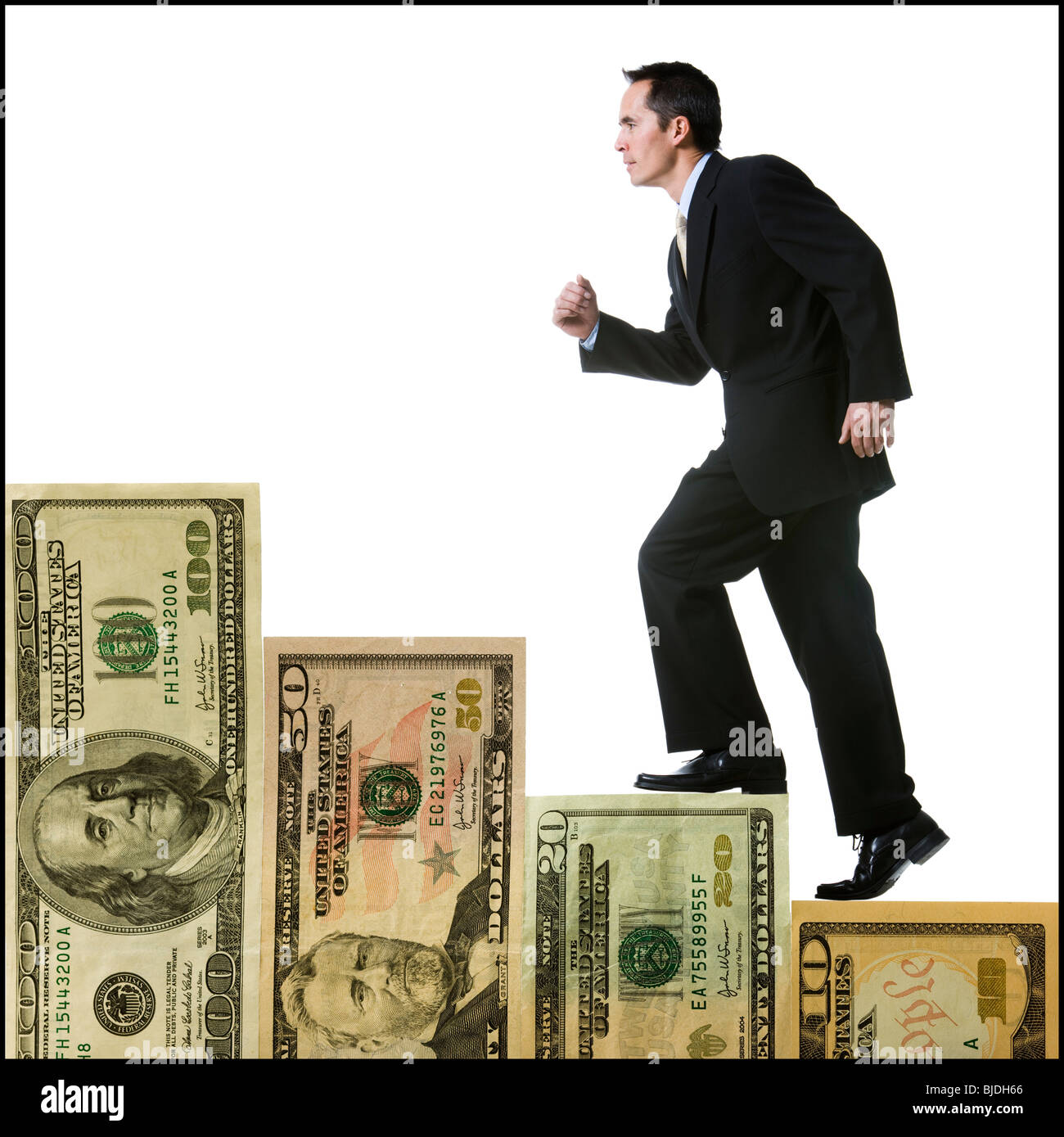businessperson climbing a staircase of money Stock Photo - Alamy