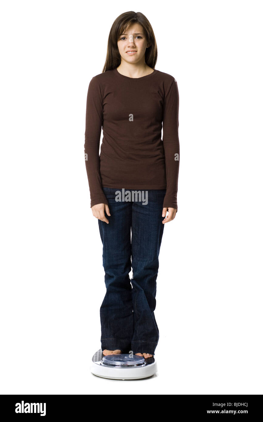 young woman on a scale Stock Photo - Alamy