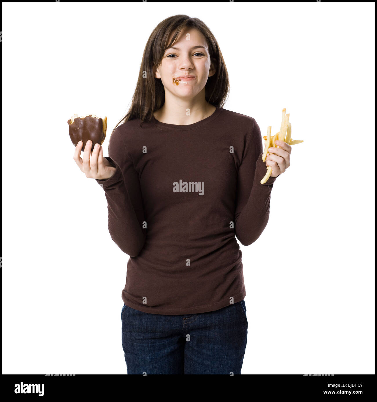 young woman eating junk food Stock Photo - Alamy