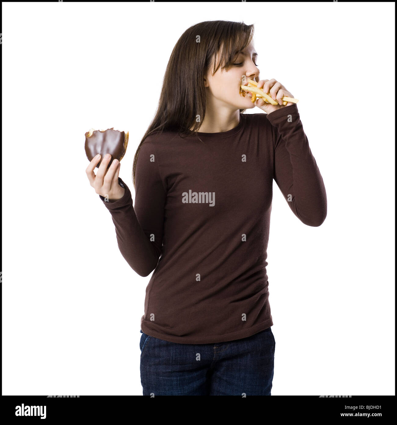 young woman eating junk food Stock Photo - Alamy