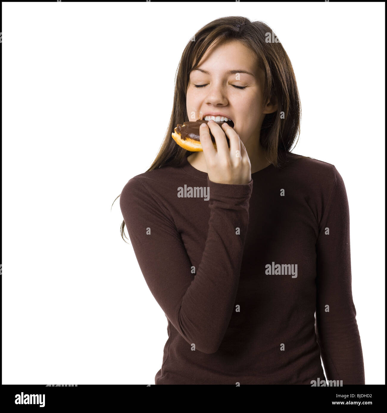 young woman eating junk food Stock Photo - Alamy
