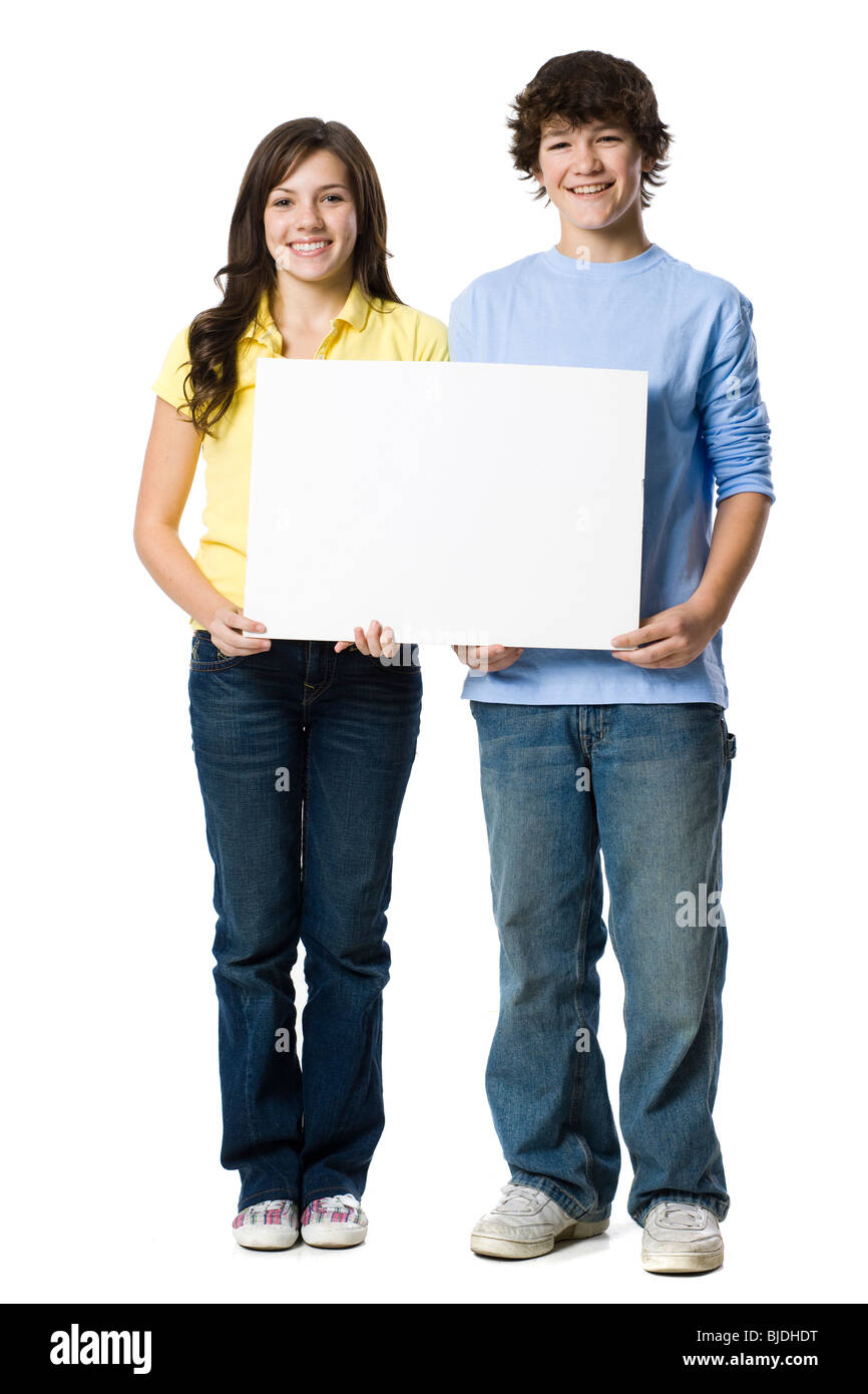 young couple holding a sign Stock Photo - Alamy
