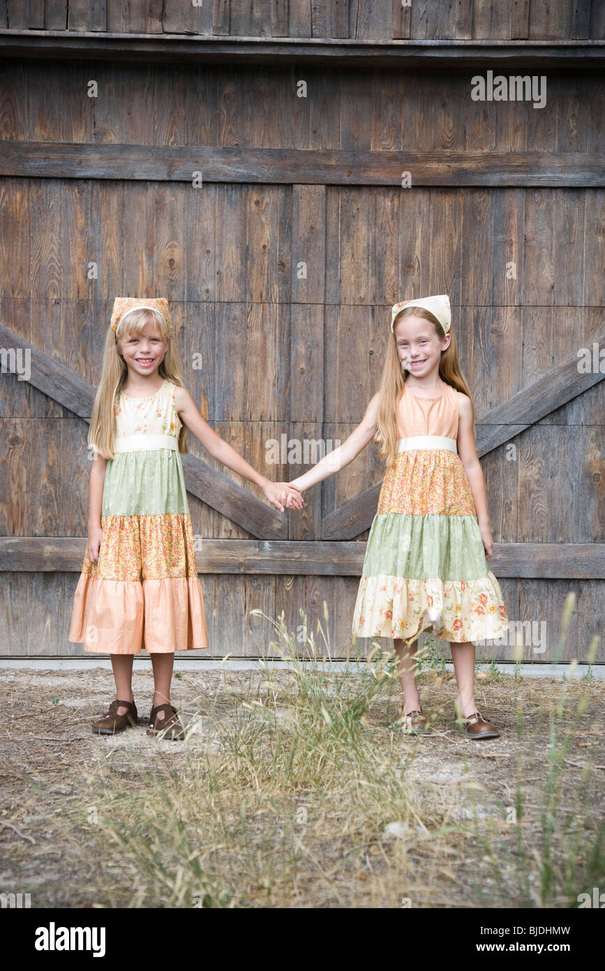 girls wearing matching dresses and kerchiefs Stock Photo - Alamy