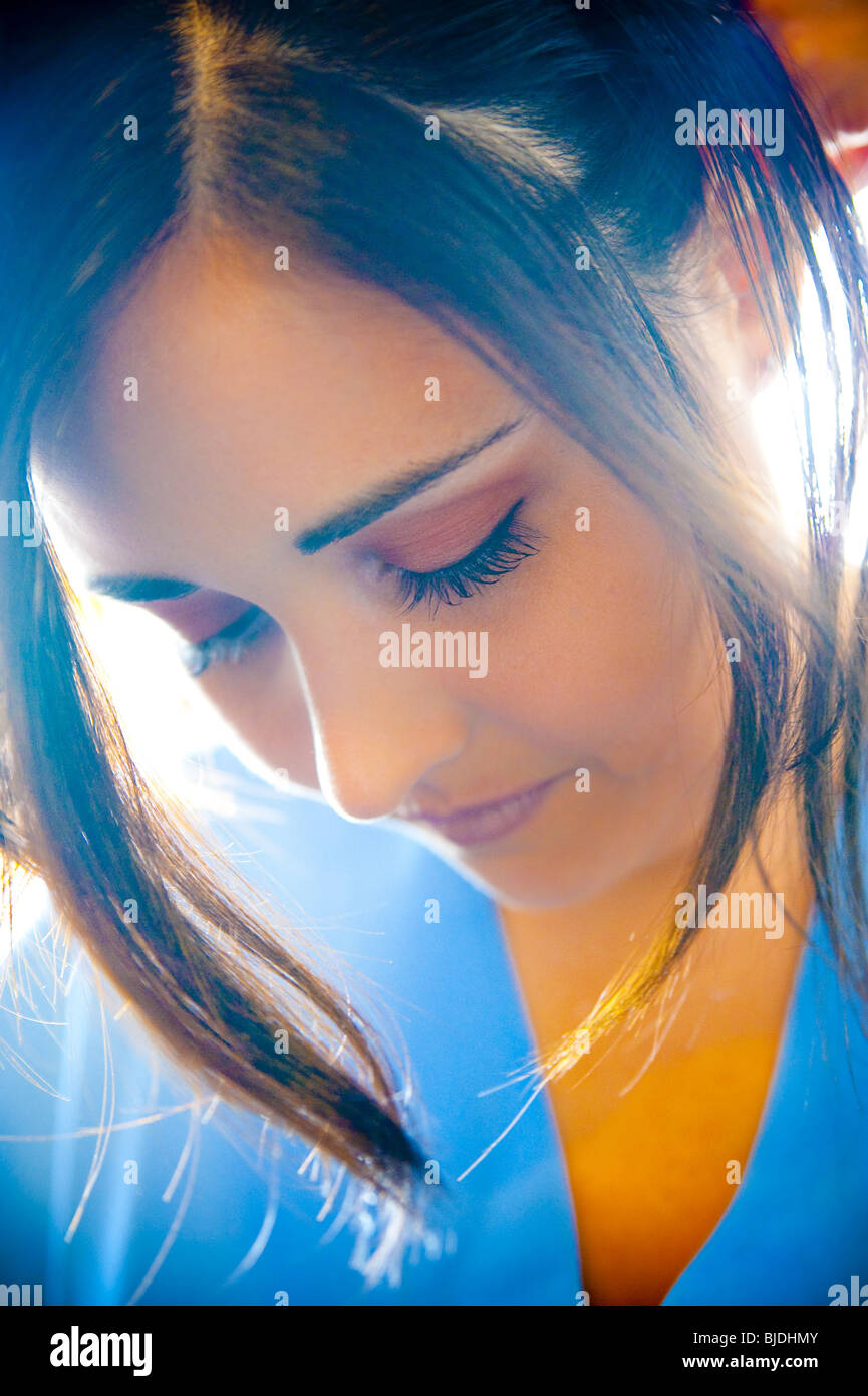 Woman looking down Stock Photo - Alamy
