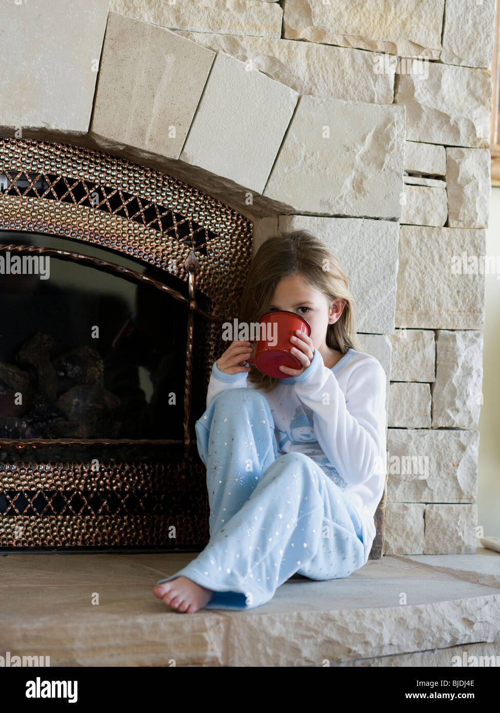 child in front of a fireplace Stock Photo - Alamy