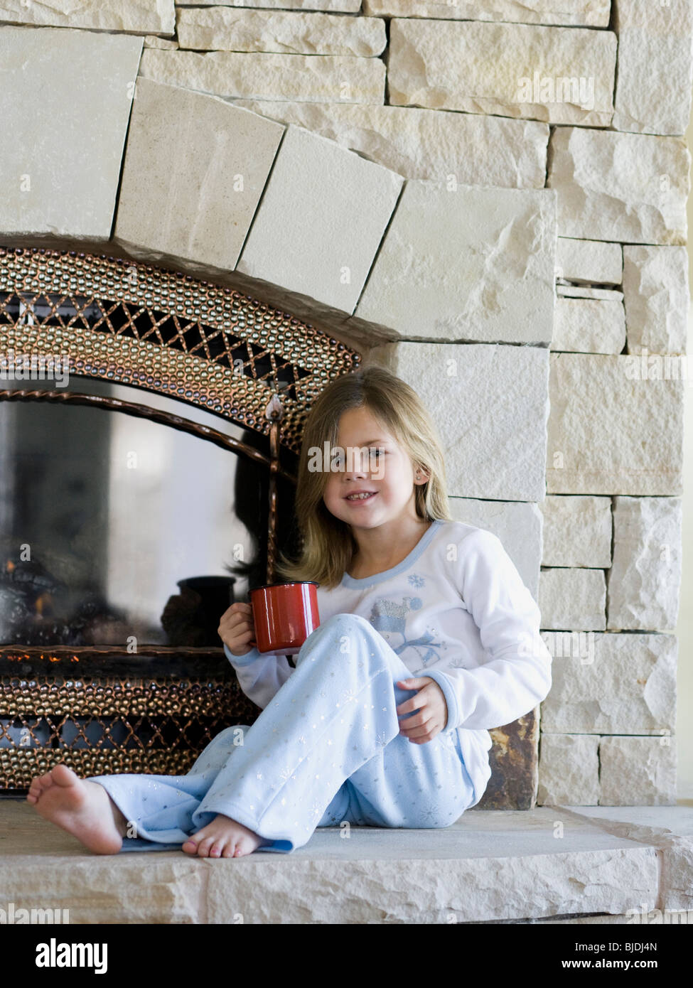 Child in front fireplace hi-res stock photography and images - Alamy