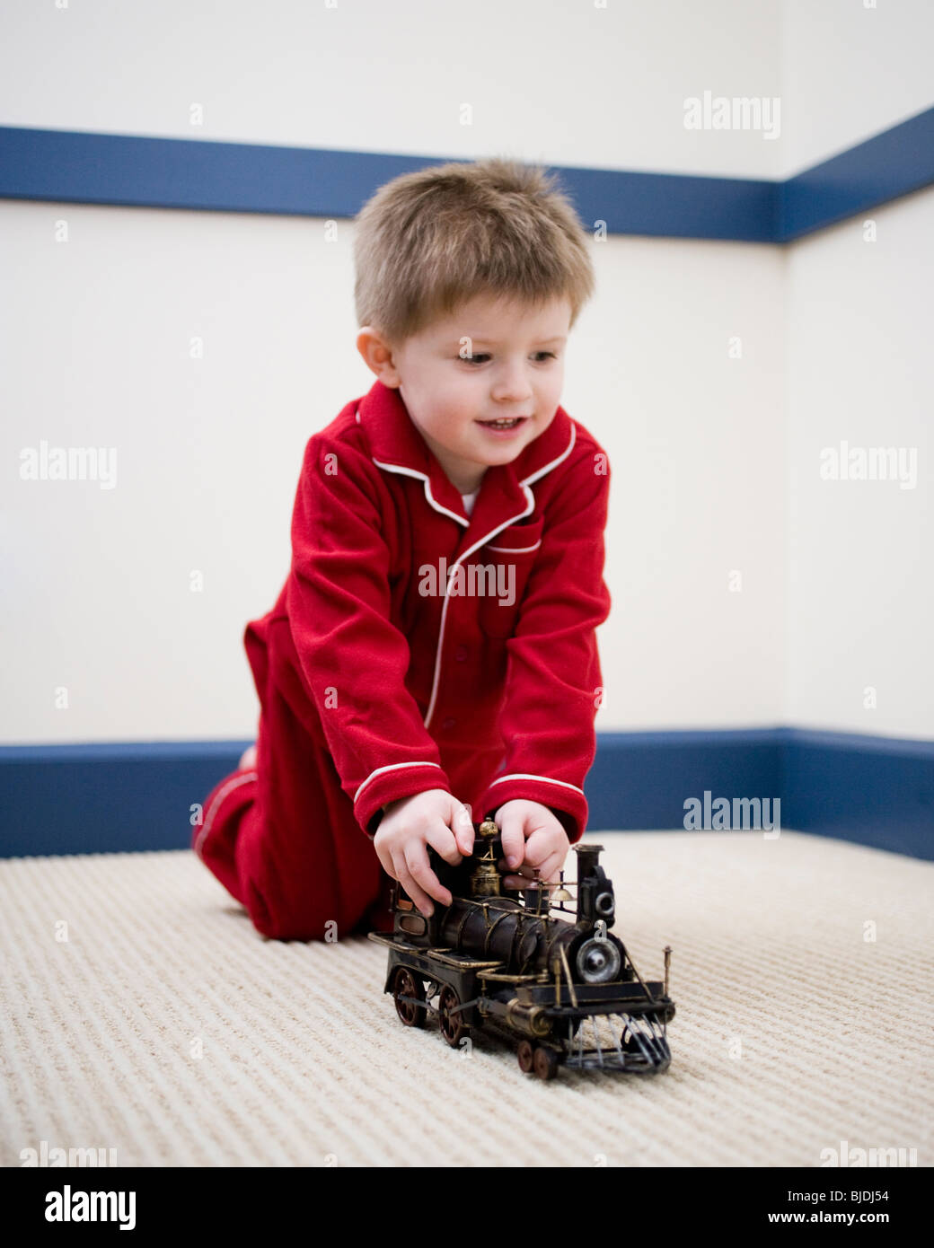 boy playing with a train Stock Photo - Alamy