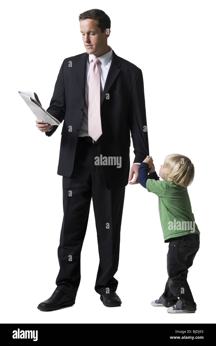 father reading a newspaper Stock Photo - Alamy