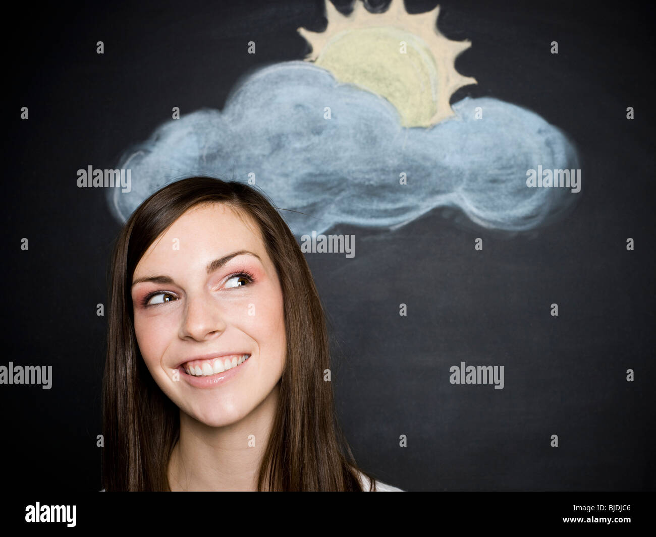 young woman against a chalkboard Stock Photo - Alamy