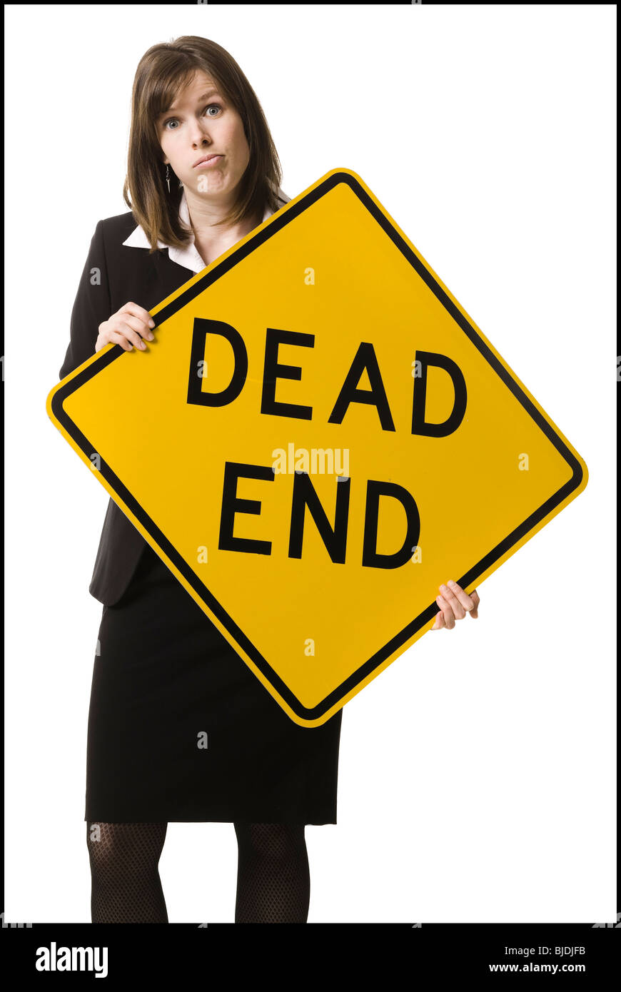 person holding a dead end sign Stock Photo - Alamy