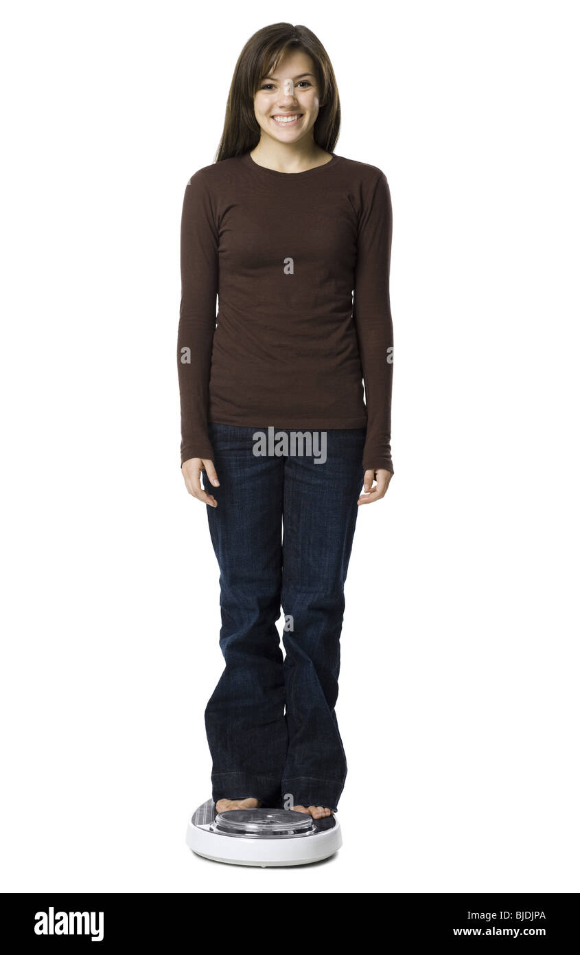 young woman on a scale Stock Photo - Alamy