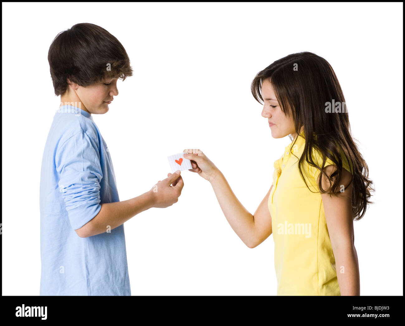 young couple passing a note Stock Photo - Alamy
