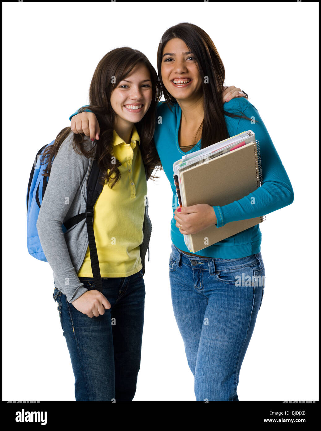 Students with book bags posing Stock Photo - Alamy