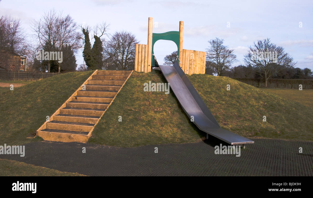 Modern slide in children playground Stock Photo - Alamy