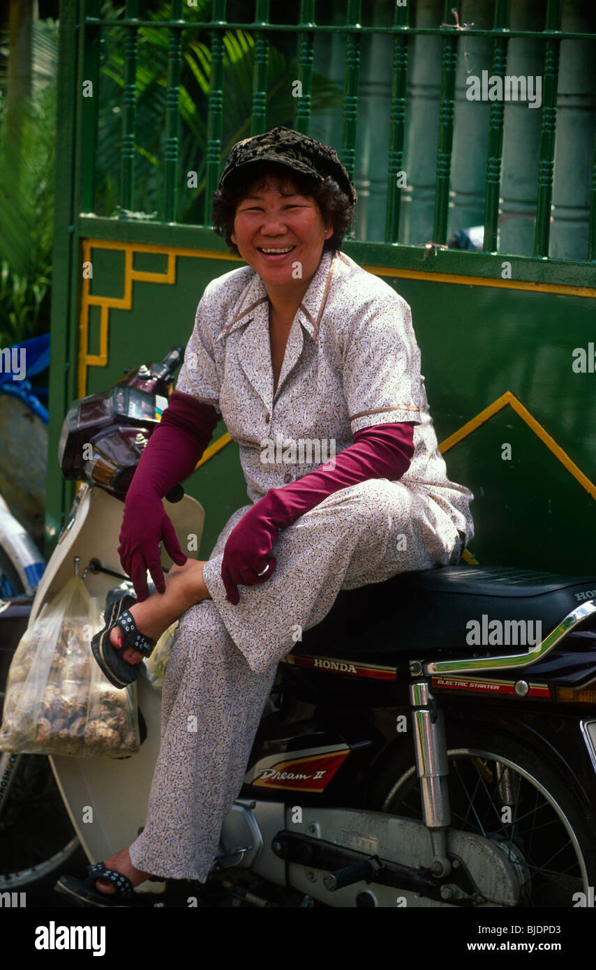 Friendly Woman on a motorcycle Stock Photo - Alamy