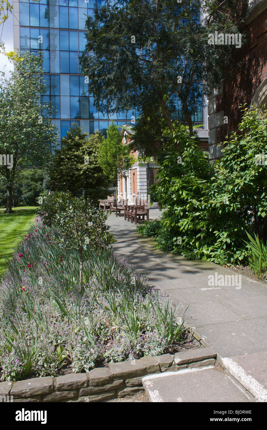 front path of St Botolph's Church, Aldgate, London with office behind ...