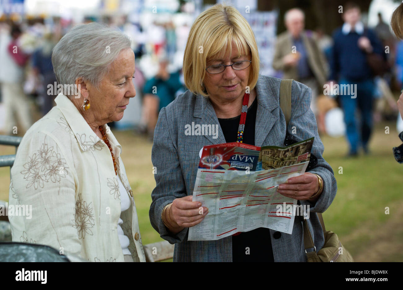 Eisteddfod visitor Ann Clwyd MP studying map of festival site, National ...