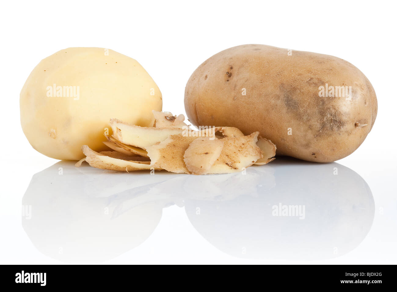 two potatoes with skins are reflected on white background Stock Photo ...