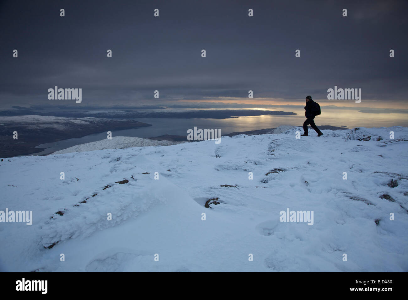 A hill walker on a snow covered Blaven (Blabheinn) on the Isle of Skye ...