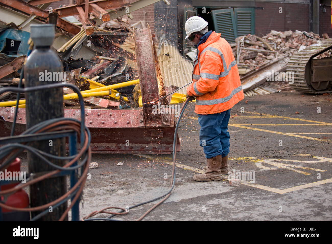 demolition squad destroy an old building to start a new development ...