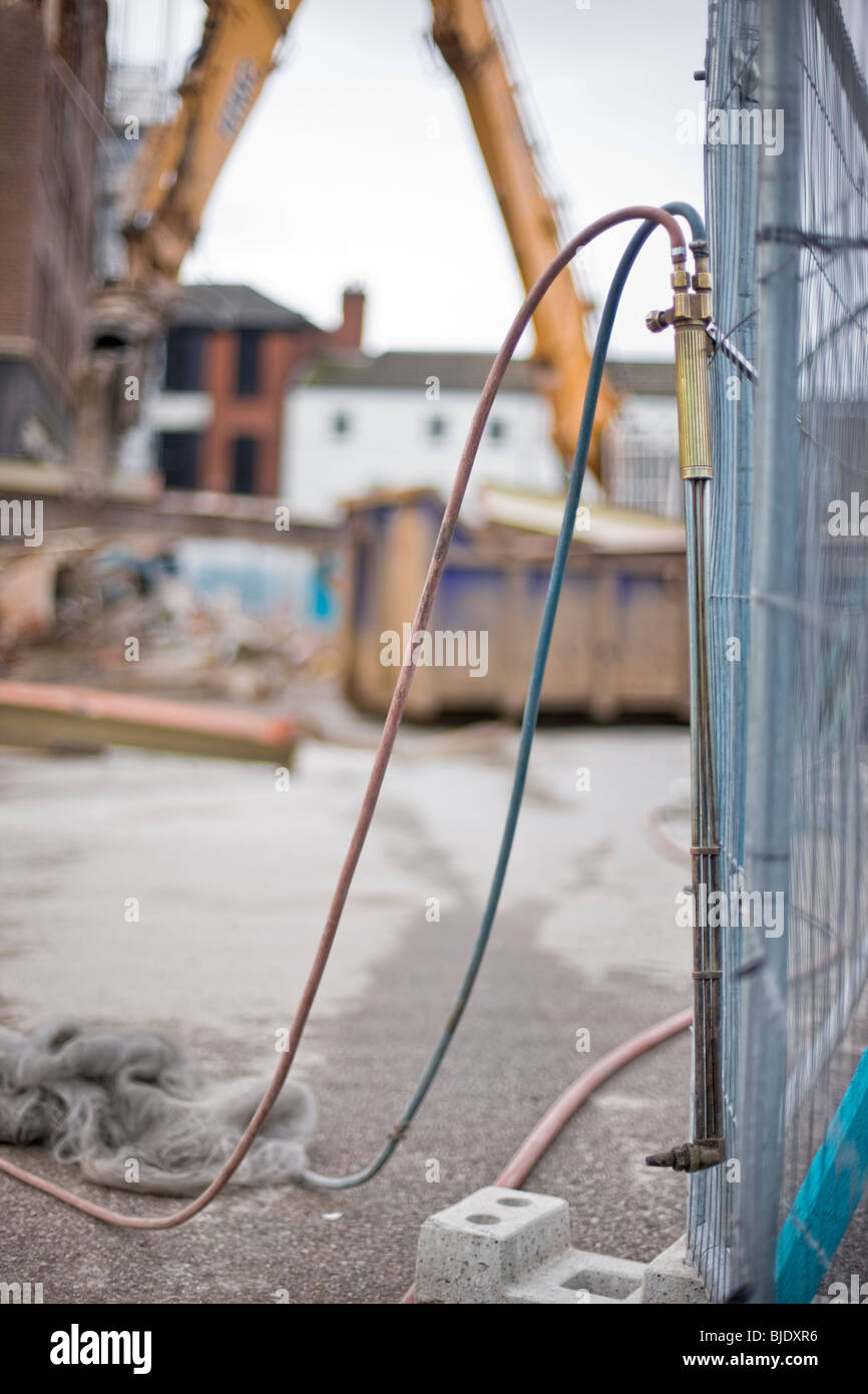 demolition squad destroy an old building to start a new development ...
