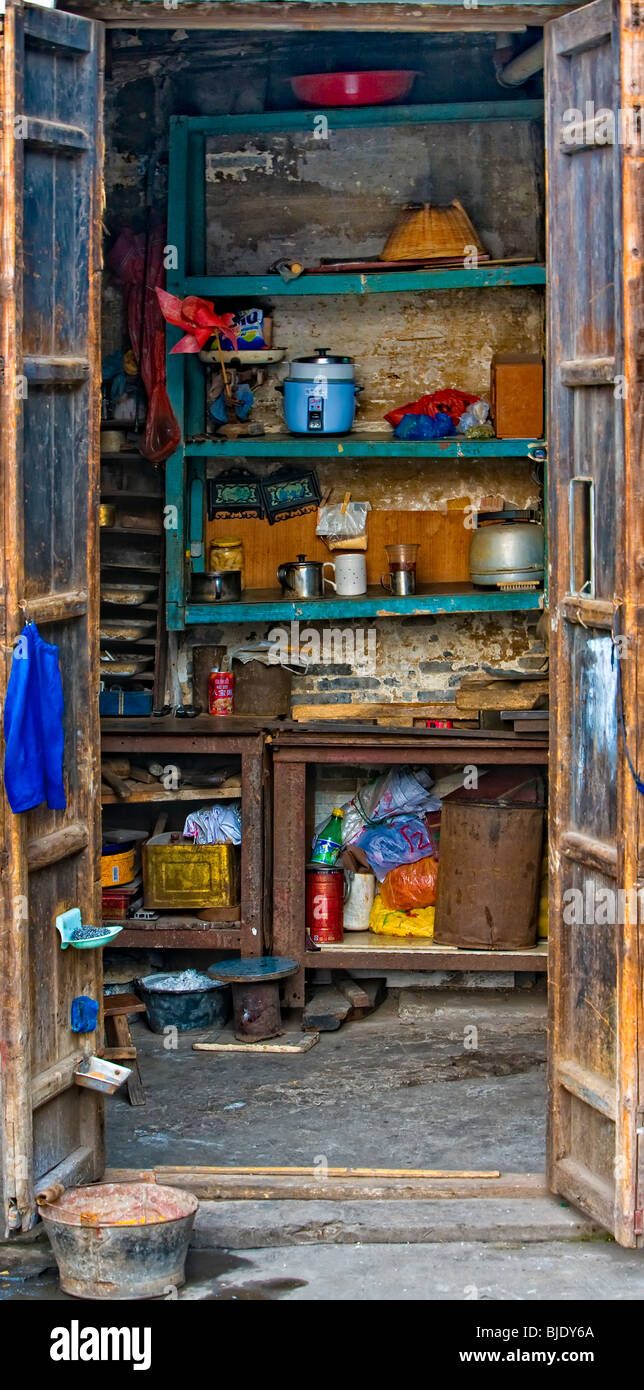 Household objects on the shelf, inside a open doorway Stock Photo - Alamy