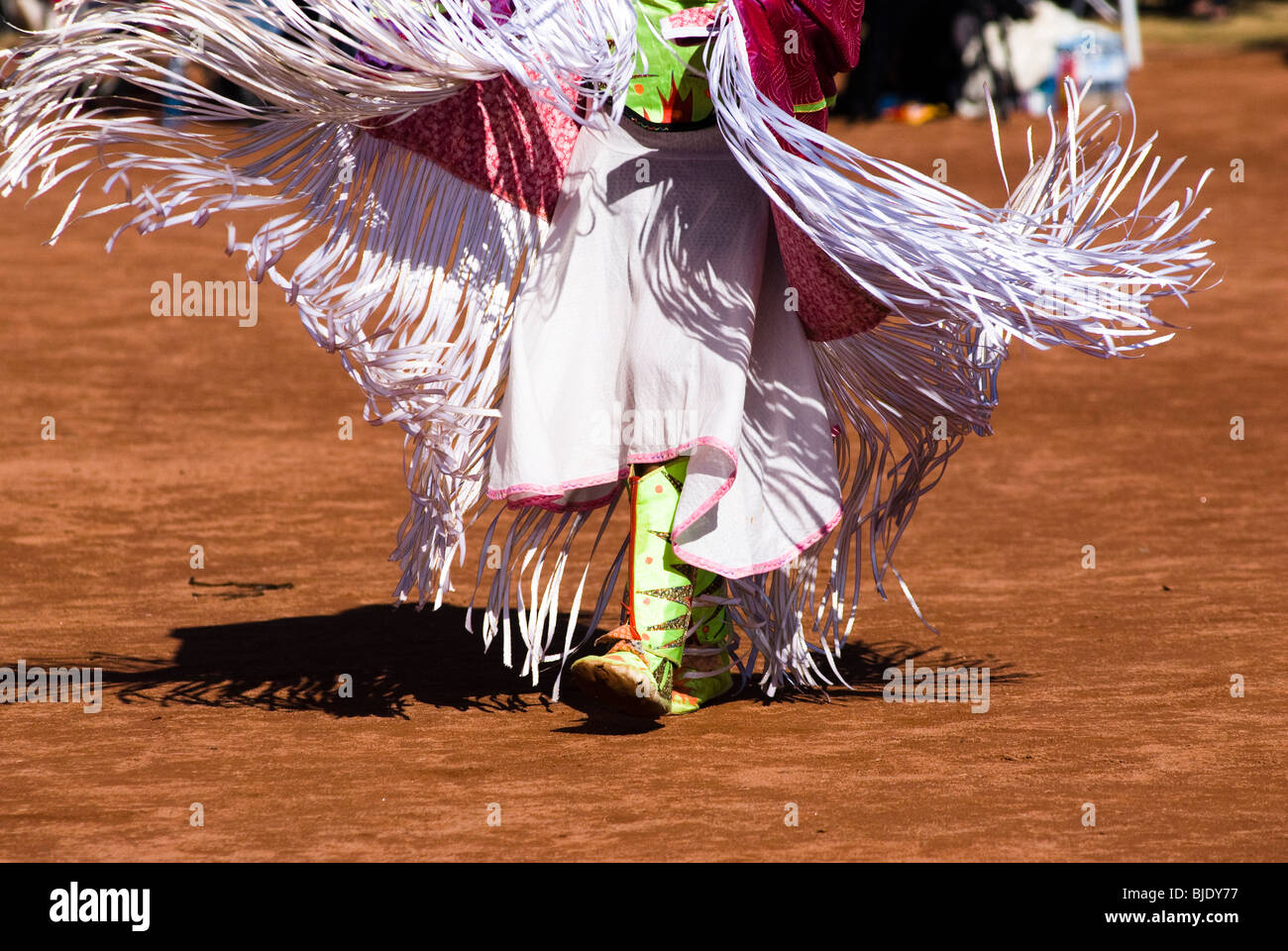 Native American dancers in traditional regalia perform during a Pow Wow ...