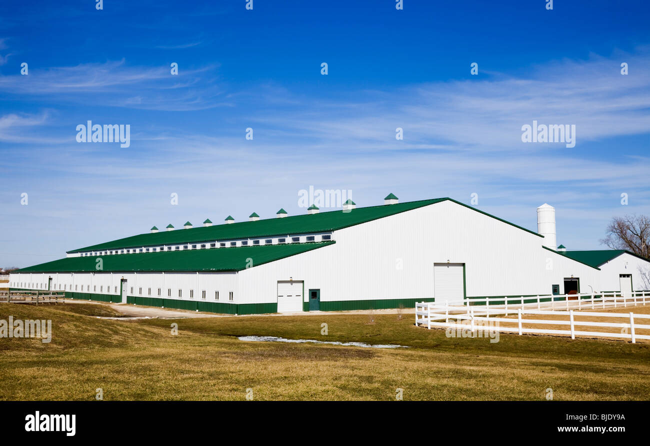 White stable with green roof Stock Photo - Alamy