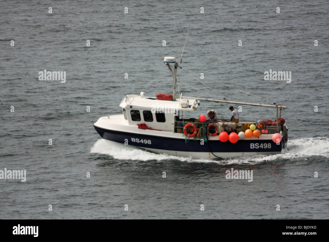 Small Fishing Boat on the Ocean Stock Photo - Alamy
