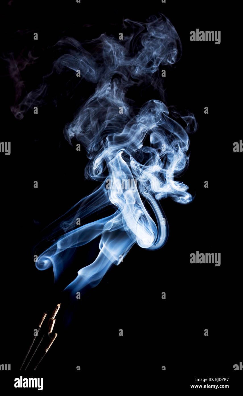 Incense smoke, abstract shape on black background Stock Photo - Alamy