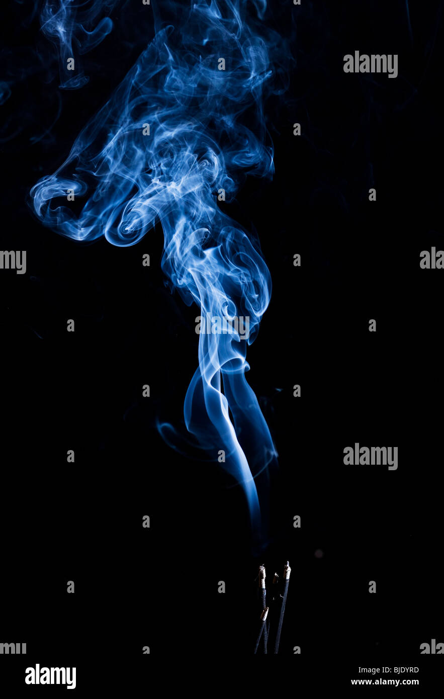 Incense smoke, abstract shape on black background Stock Photo - Alamy