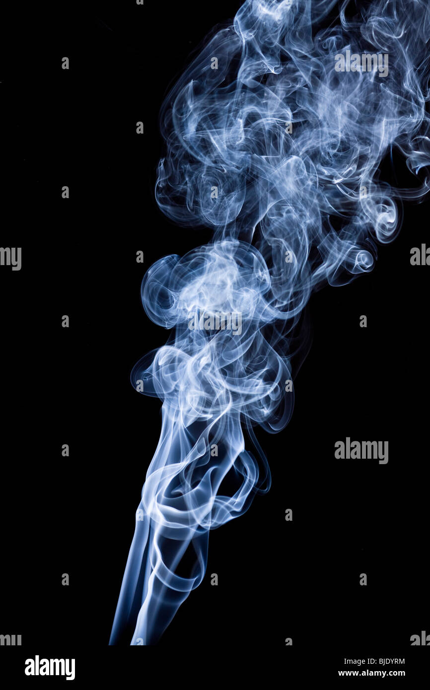 Incense smoke, abstract shape on black background Stock Photo - Alamy