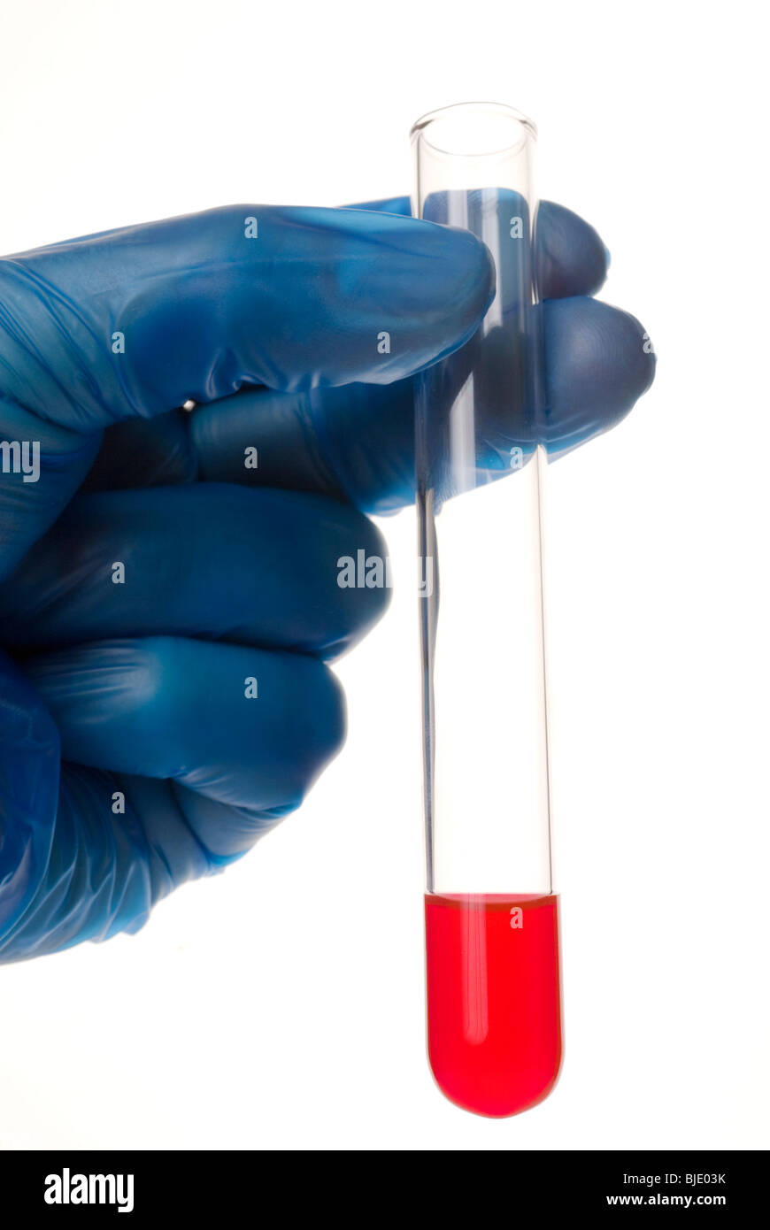 Gloved hand holding test tubes hi-res stock photography and images - Alamy