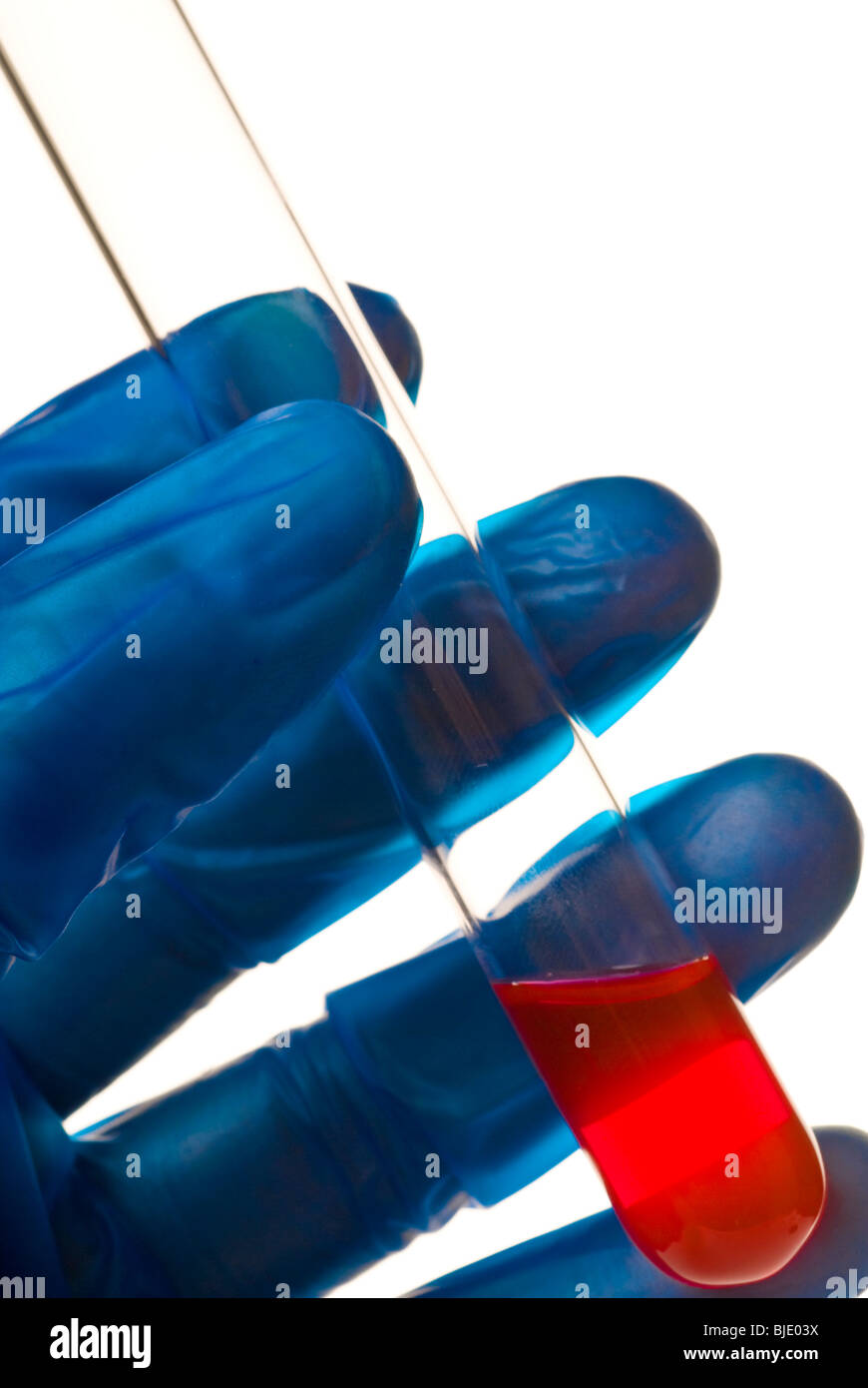 gloved hand holding test tube Stock Photo - Alamy