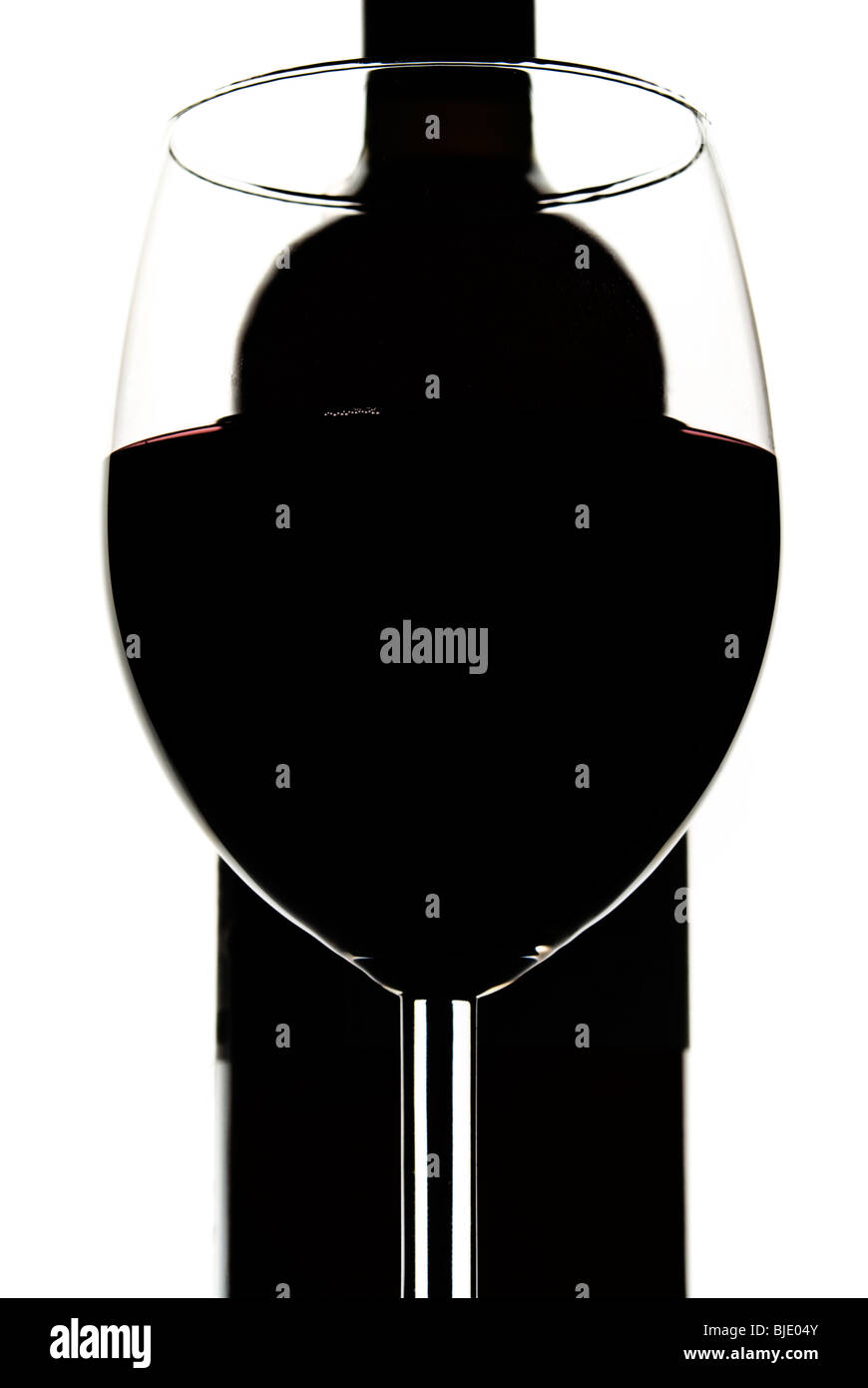 wine glass stood in front of bottle Stock Photo - Alamy