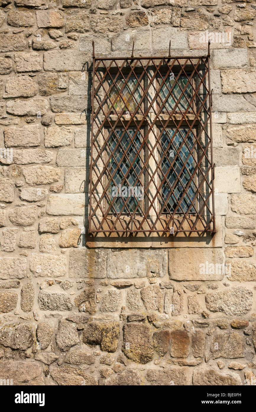 Old window with rusty metal frame in a stone wall Stock Photo - Alamy