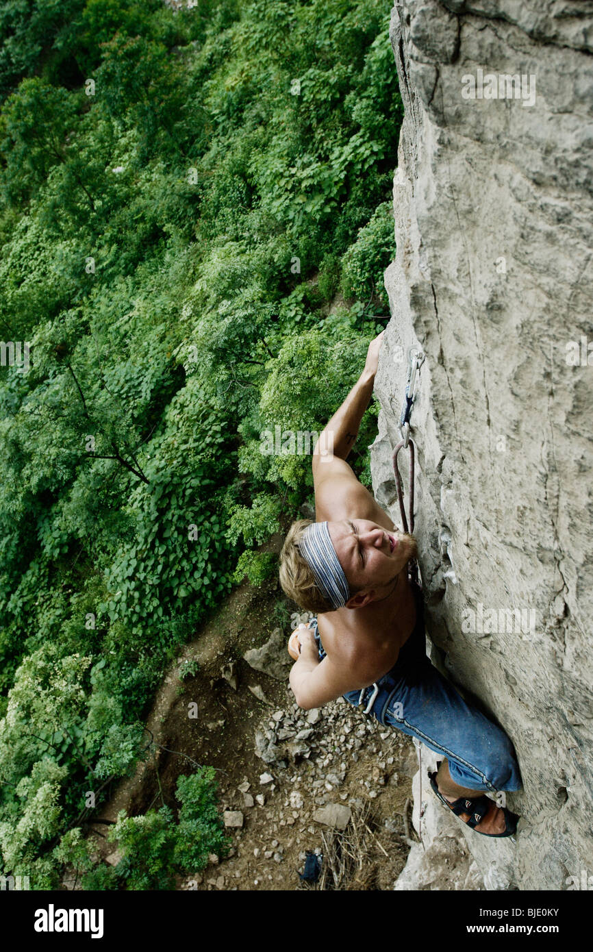 Finnish rock climbing guide Kalle Viira climbing on the limestone ...